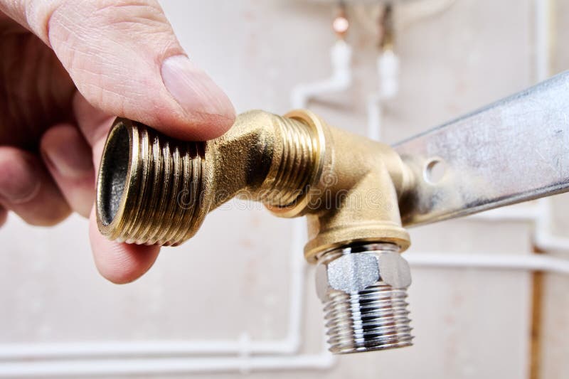 Plumber is Assembling Brass Elbow Fitting and an Eccentric Reducer ...