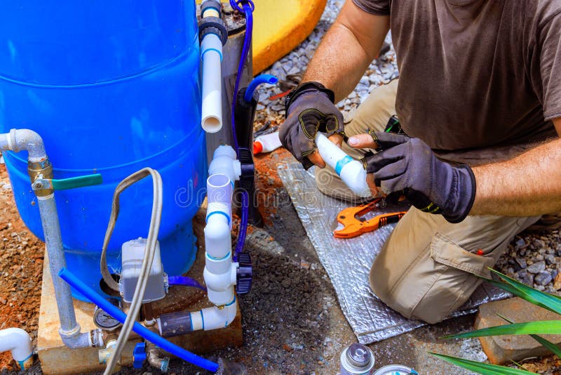 Plumber is Assembling Connection Service between a Well Water System in ...