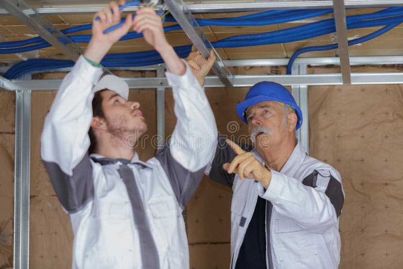 Plumber Checking Ceiling Pipes Stock Image - Image of laborer ...