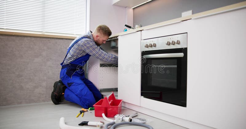 Plumber Cleaning Clogged Sink Pipe with Drained Cable Stock Photo ...