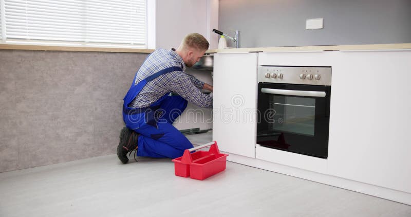 Plumber Cleaning Drain and Pipe Stock Photo - Image of holding, service ...
