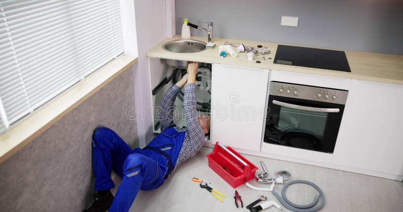 Plumber Cleaning Kitchen Drain and Pipe Stock Image - Image of cleaning ...