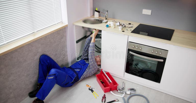 Plumber Cleaning Kitchen Drain and Pipe Stock Image - Image of cleaning ...