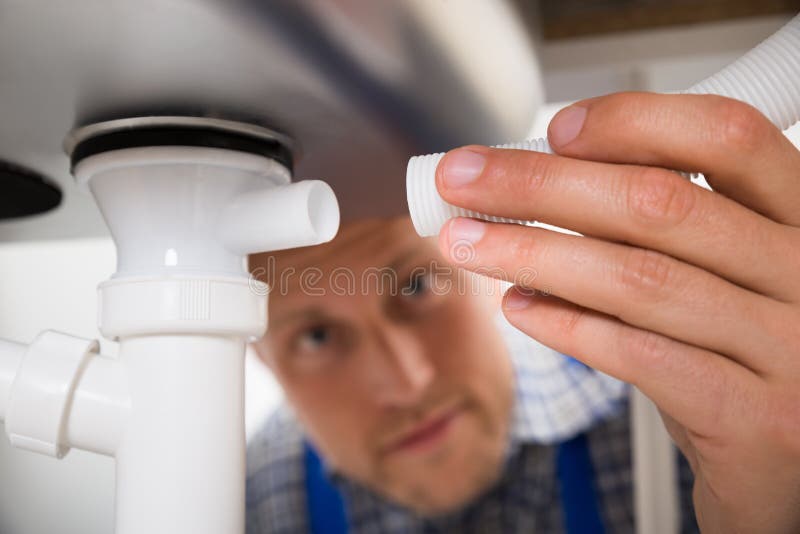 Plumber Connecting Pipe To Sink Stock Image - Image of mechanic ...
