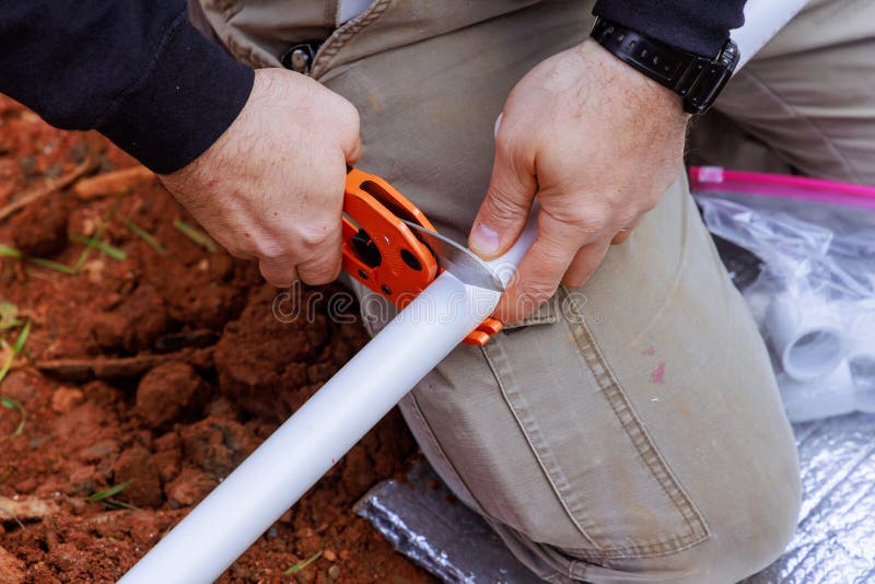 Plumber Cuts Plastic PVC Pipe with a Special Pair of Scissors Stock ...