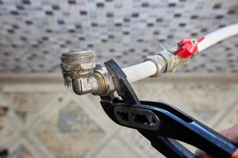 Plumber Unscrews Elbow Adapter Compression Fitting Nut with an ...