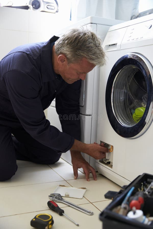 Person Fixing Washing Machine. Stock Image - Image of washer ...