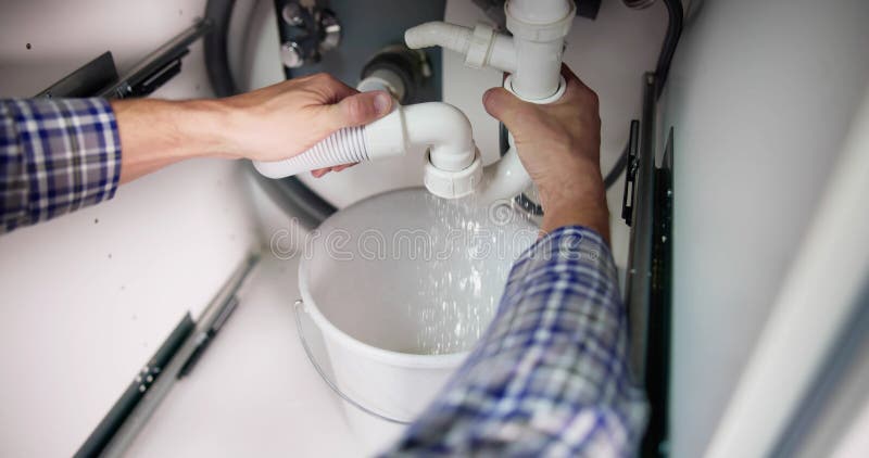 Plumber Fixing Pipe Leak stock photo. Image of leak - 270230028