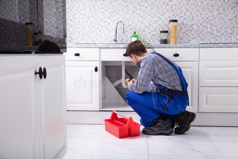 Plumber Fixing Sink in Kitchen Stock Image - Image of plumber, plumbing ...
