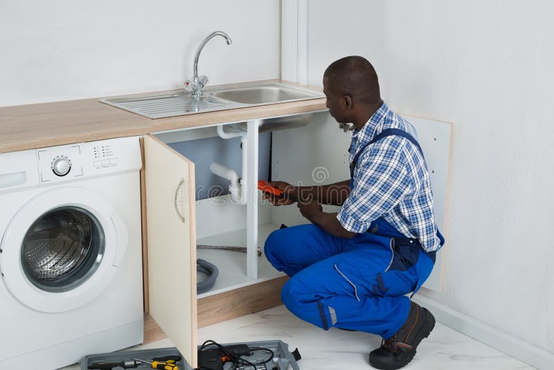 Plumber Fixing Sink in Kitchen Stock Photo - Image of mechanic, labor ...
