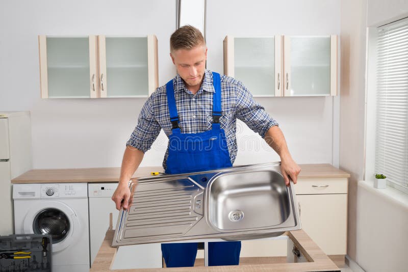 Plumber Fixing Sink stock image. Image of equipment, handyman - 57403675