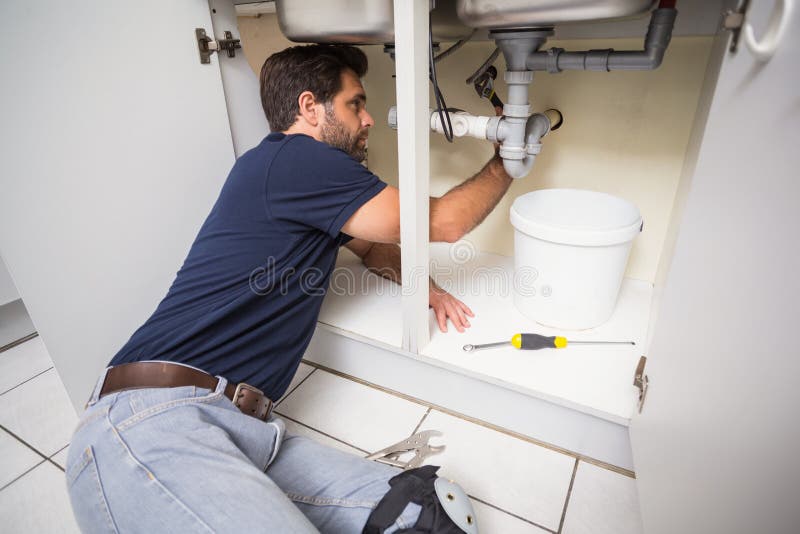 Plumber Fixing Under the Sink Stock Photo - Image of profession, person ...