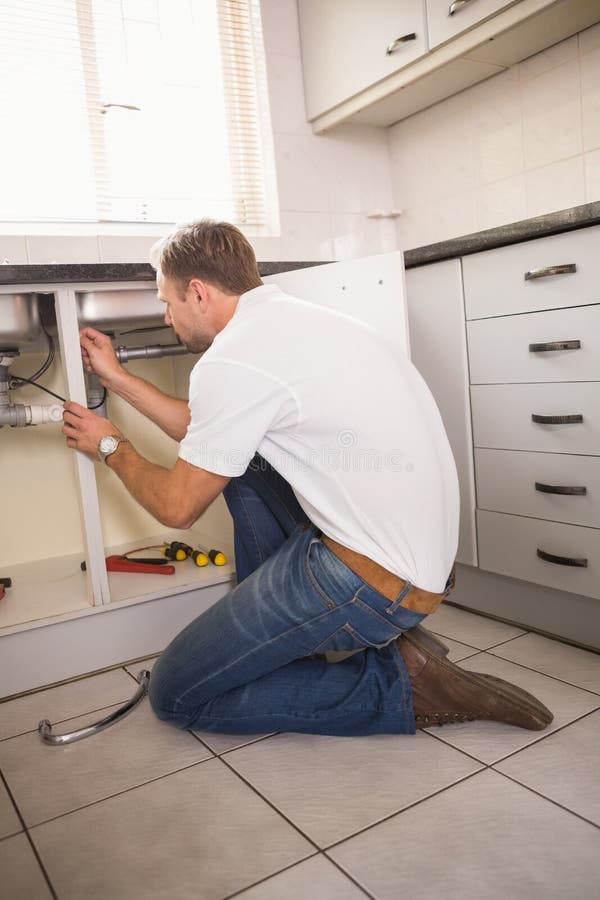 Plumber Fixing Under the Sink Stock Photo - Image of professional ...