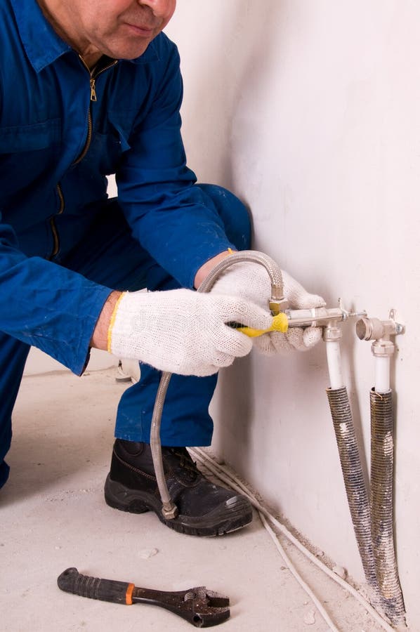 Plumber fixing water pipe stock image. Image of engineering - 19467815