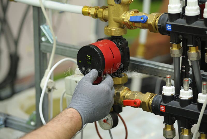 Plumber Hand in Glove Touching the Screen of the Boiler Pump Stock ...