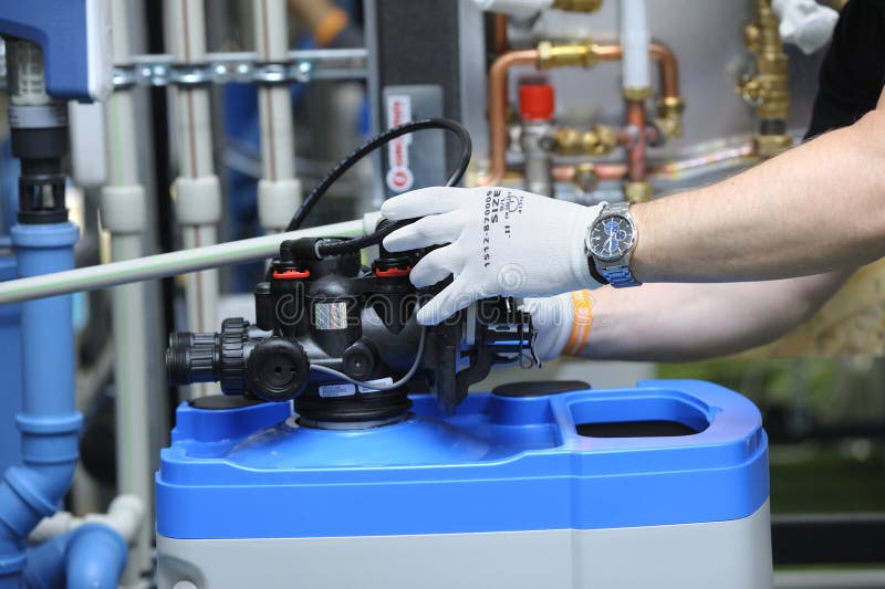 Plumber Hands in Gloves Joining Compact Water Filter To Water Tank of ... Plumber Hands in Gloves Joining Compact Water Filter To Water Tank of ...