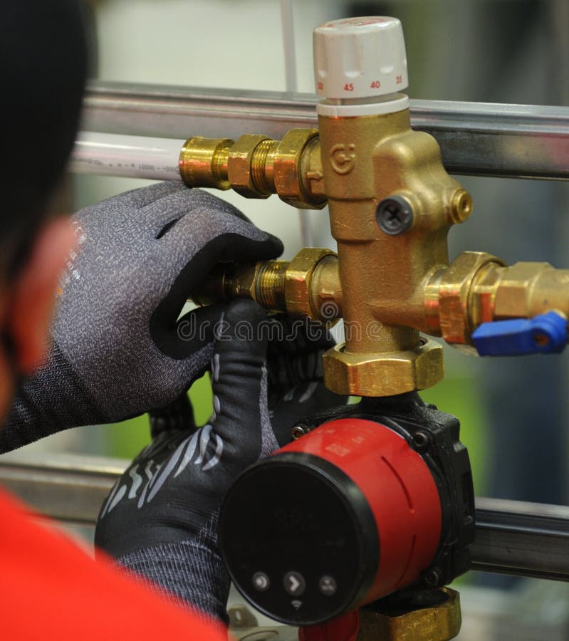 Plumber Hands Installing Circulation Pump for Heating System Stock ...