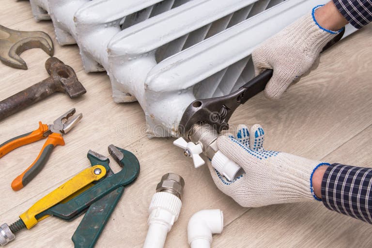 Plumber Hands Repairing Valve of Broken Radiator Central Heating with ...