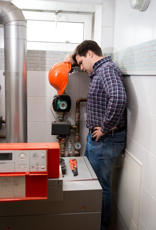 Confused Plumber Looking Complicated Heating System Stock Photos - Free ...