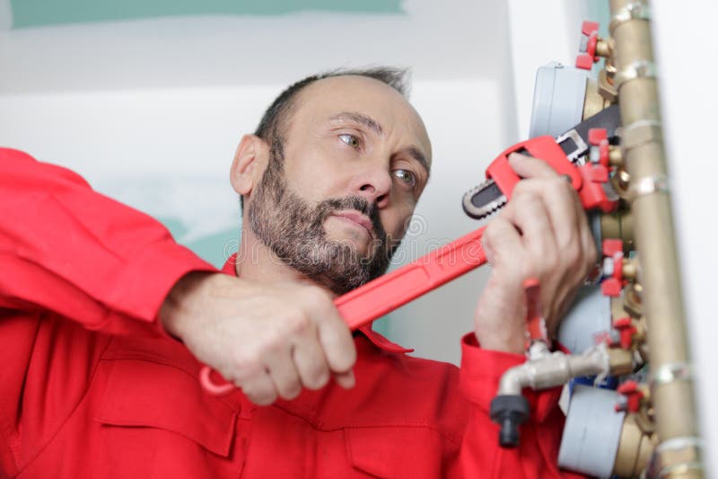 Plumber Installing Pressure Meter for House Heating System Stock Image ...