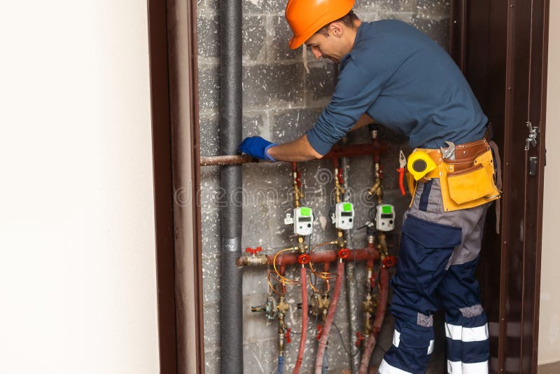 Plumber Installing Pressure Meter for House Heating System Stock Photo ...