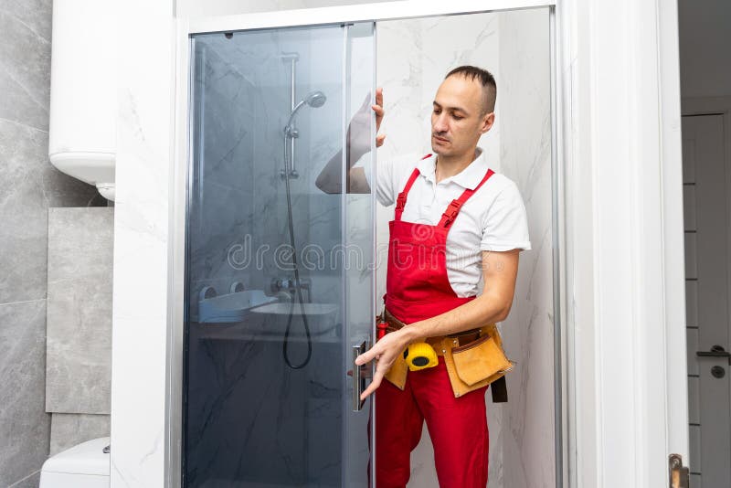 Plumber Installing a Shower Cabin in Bathroom Stock Image - Image of ...