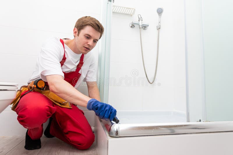 Plumber Installing a Shower Cabin in Bathroom Stock Photo - Image of ...
