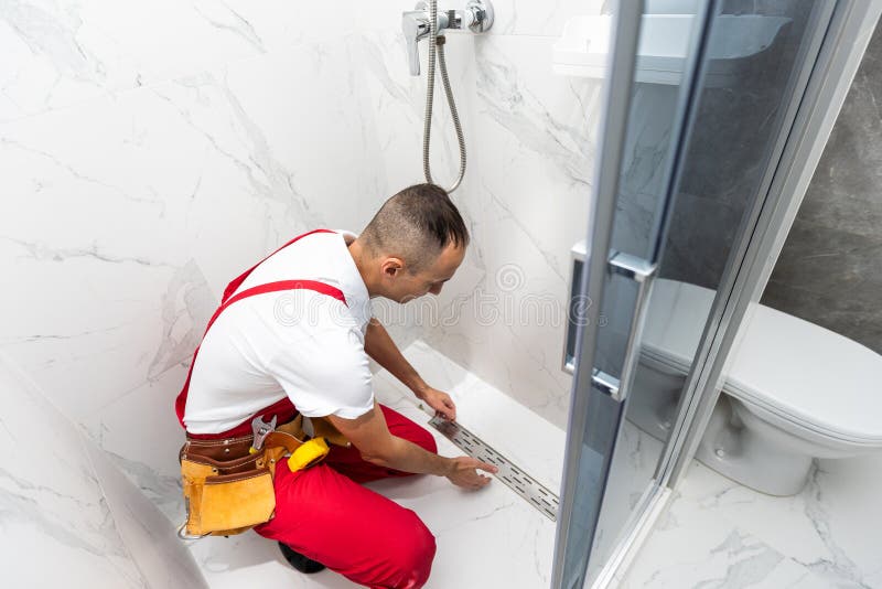 Plumber Installing a Shower Cabin in Bathroom Stock Photo - Image of ...