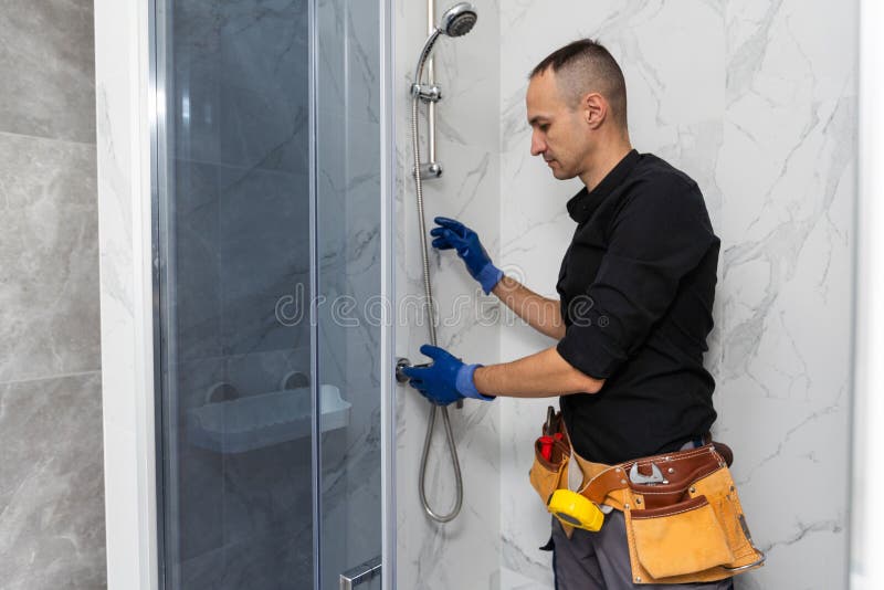 Plumber Installing a Shower Cabin in Bathroom Stock Image - Image of ...