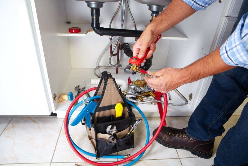 Plumber on the kitchen. stock image. Image of clogged - 59609307