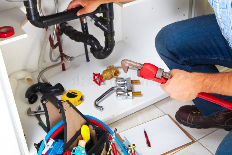 Plumber on the kitchen. stock image. Image of house, hand - 48565387