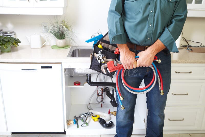 Plumber on the kitchen. stock image. Image of service - 47973687