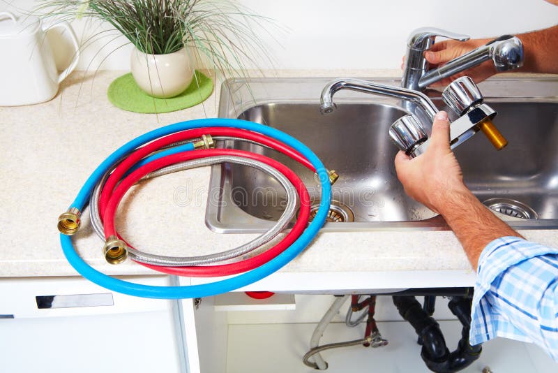 Plumber on the kitchen. stock image. Image of service - 47973687