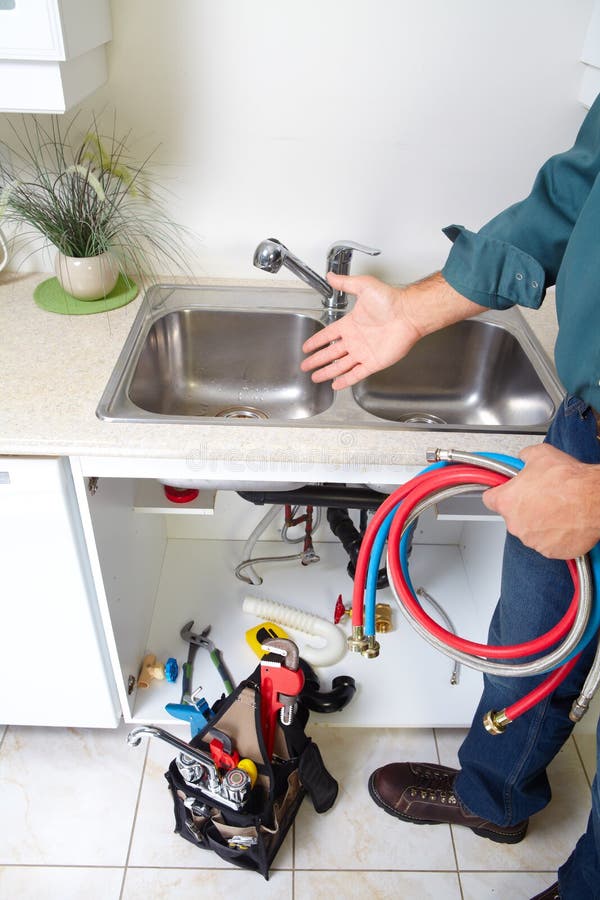 Plumber on the kitchen. stock image. Image of adjustable - 64479899