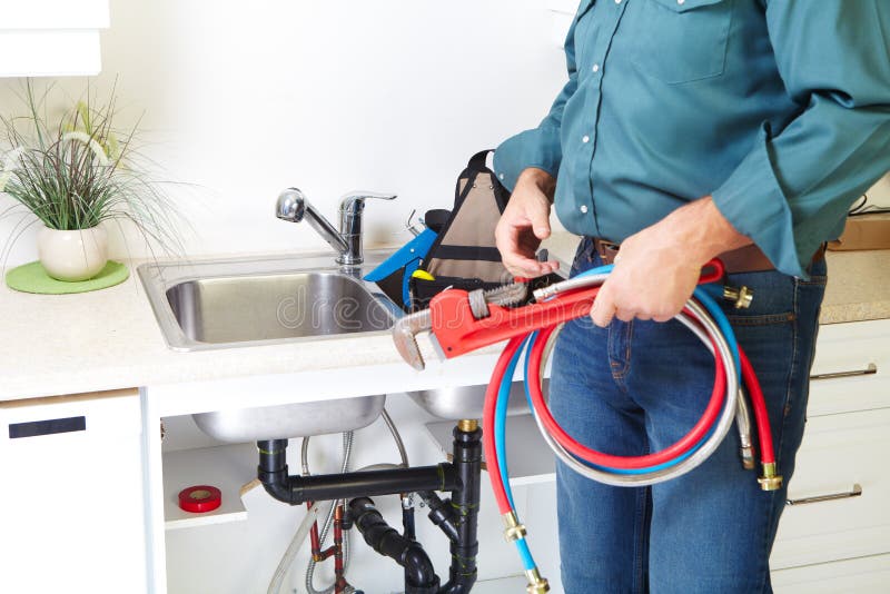 Plumber on the kitchen. stock image. Image of human, hands - 64479911
