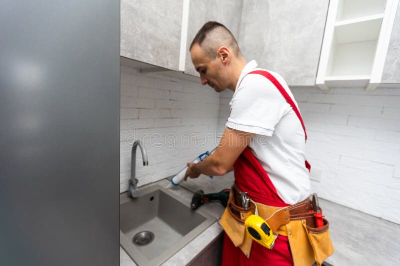 The Plumber on the Kitchen Sink. Stock Photo - Image of food, electric ...