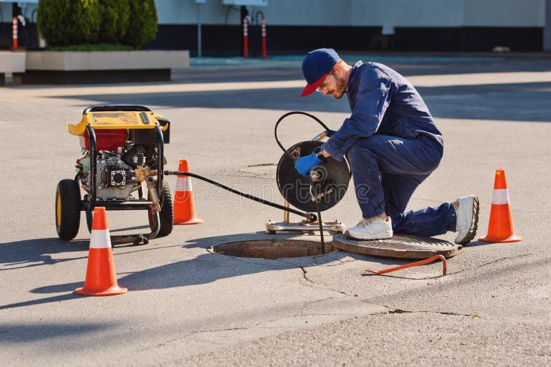 Plumber Prepares To Fix the Problem in the Sewer. Repair Work on ...
