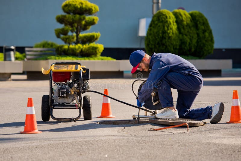 The Plumber Prepares To Fix the Problem in the Sewer. Repair Work on ...