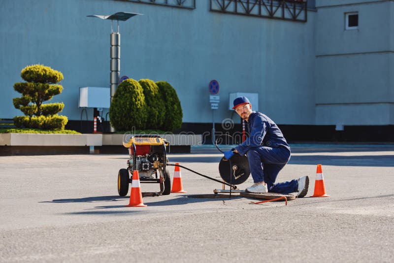 The Plumber Prepares To Fix the Problem in the Sewer. Repair Work on ...