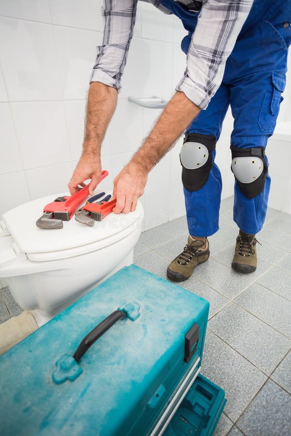 Plumber Putting His Tools on Toilet Stock Photo - Image of maintenance ...