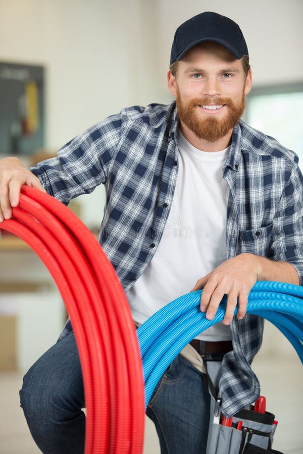 Plumber with Reels Blue and Red Cabling Stock Image - Image of bending ...