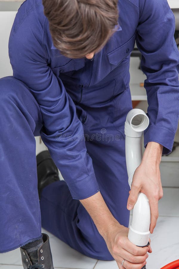 Plumber replacing the pipe stock image. Image of domestic - 74304101