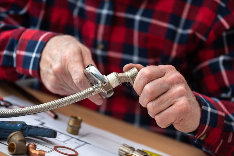 Plumber Screwing a Plumbing Fitting Stock Photo - Image of worker ...