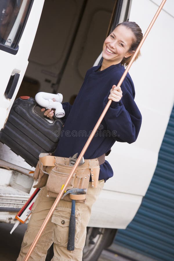 Plumber standing with van stock photo. Image of toolbelt - 5940822