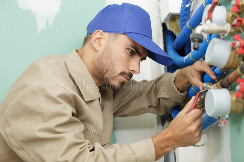 Plumber Technician Works with Water Meter Stock Image - Image of room ...