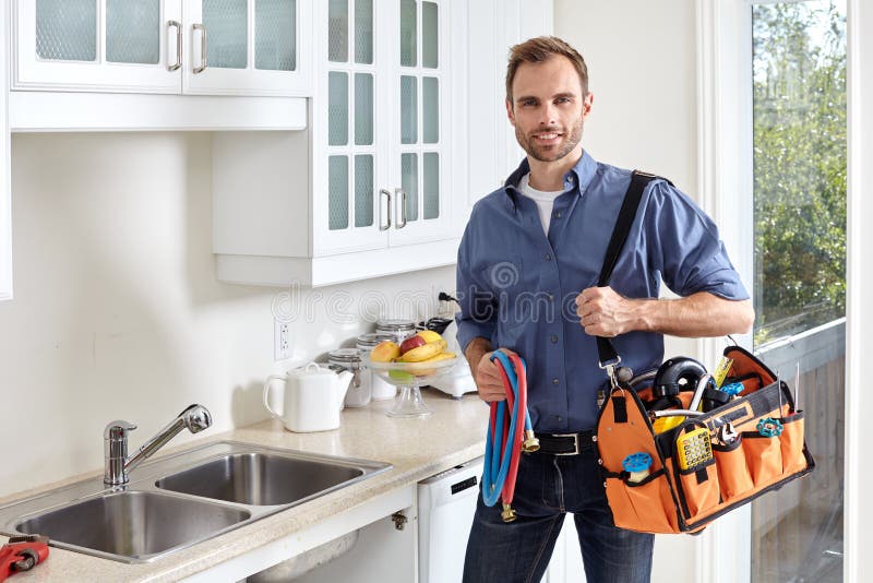 Working Man Plumber Repairs Washing Machine in Laundry Stock Photo ...