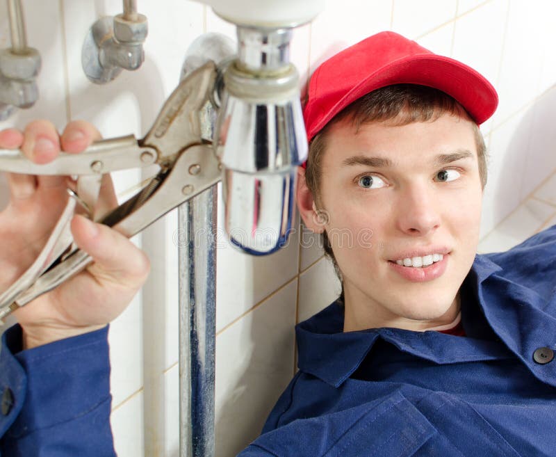 Plumber in uniform stock image. Image of pliers, smile - 29235113