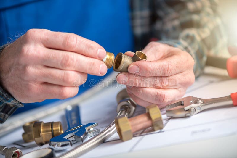 Plumber Using Plumbing Fittings, Light Effect Stock Photo - Image of ...