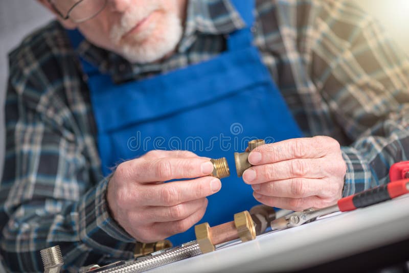 Plumber Using Plumbing Fittings Light Effect Stock Photos - Free ...