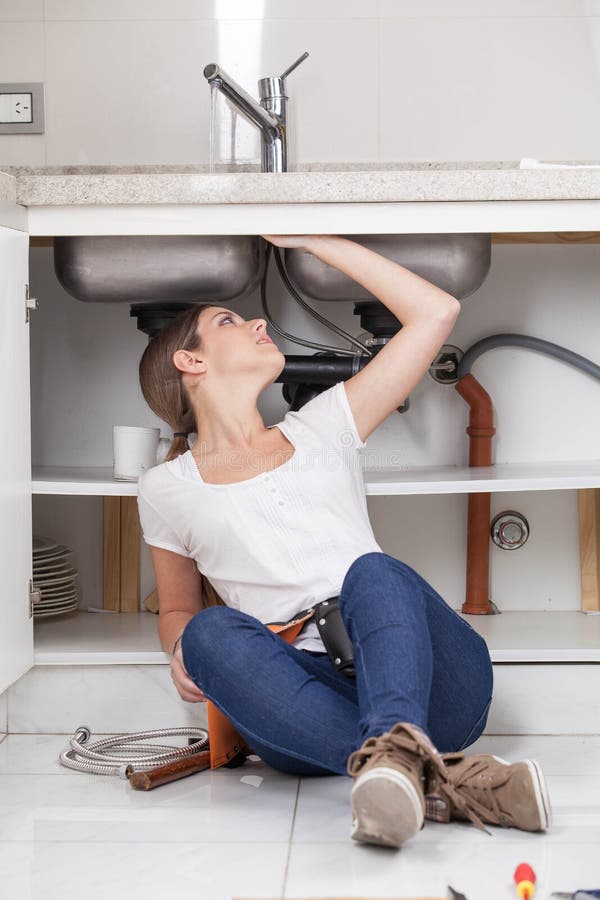 Plumber Woman Sitting Fixing the Pipe Stock Photo - Image of emotions ...
